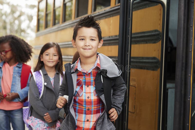 Elementary School Kids Queueing for the School Bus Stock Image - Image ...