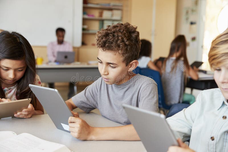 Kids Use Tablet Computers in Primary School Class, Close Up Stock Image ...