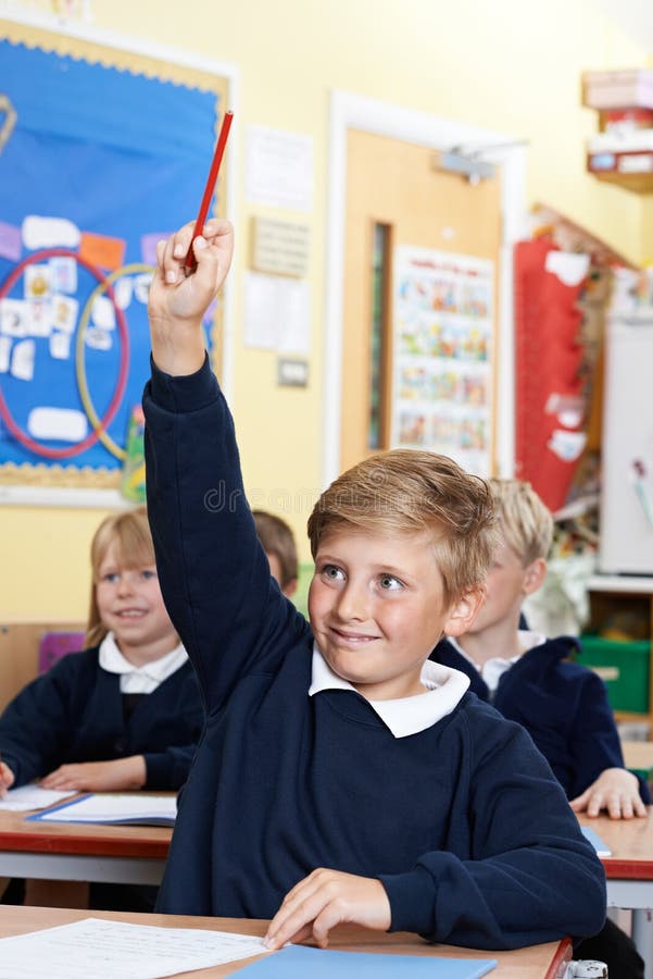 Elementary School Pupil Answering Question in Class Stock Image - Image ...