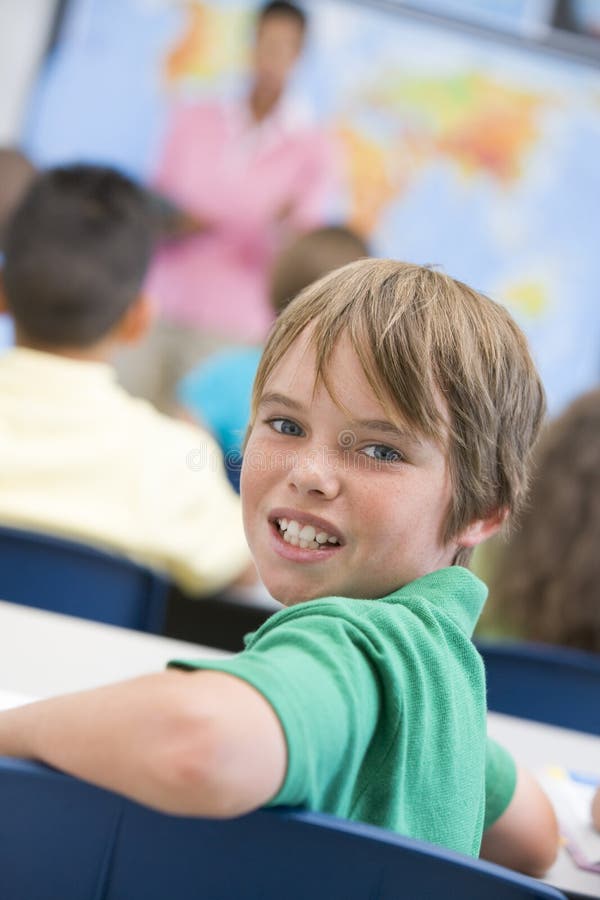 Elementary School Pupil in Classroom Stock Photo - Image of ethnicity ...