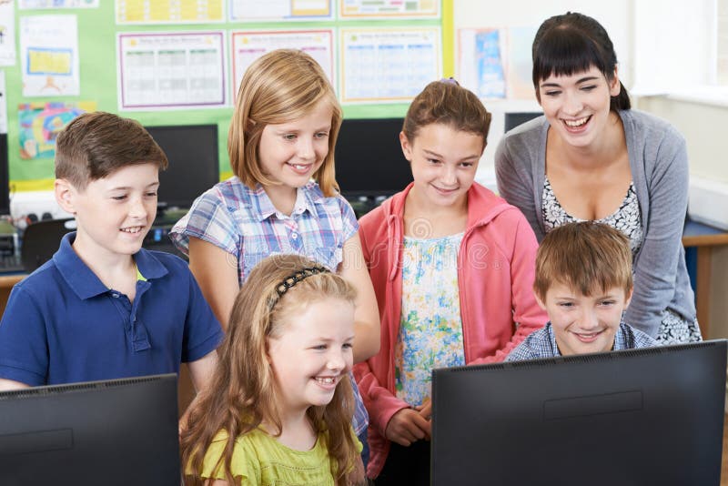 Elementary School Pupils with Teacher in Computer Class Stock Photo ...