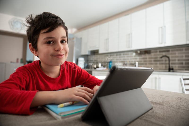 Elementary School Student Boy on Distance Learning, Smiling Looking at ...