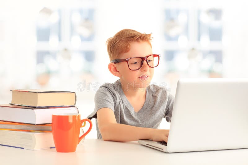 Elementary School Student Looking at Computer Stock Photo - Image of ...