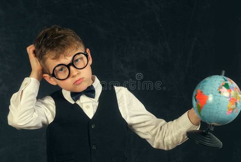 Elementary School Student with a Model of the Earth . Stock Image ...