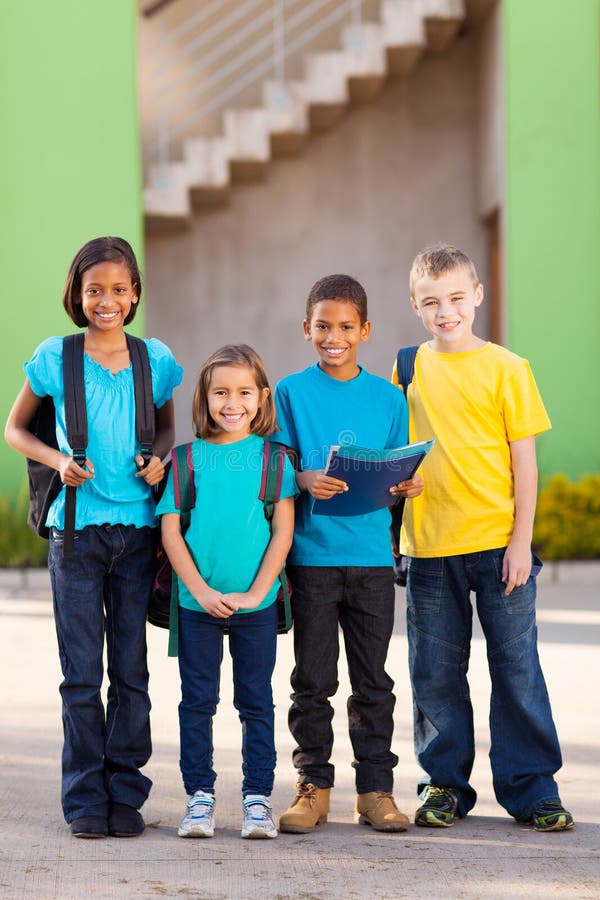 A Group of Energetic Elementary School Kids Leaving School Stock Photo ...