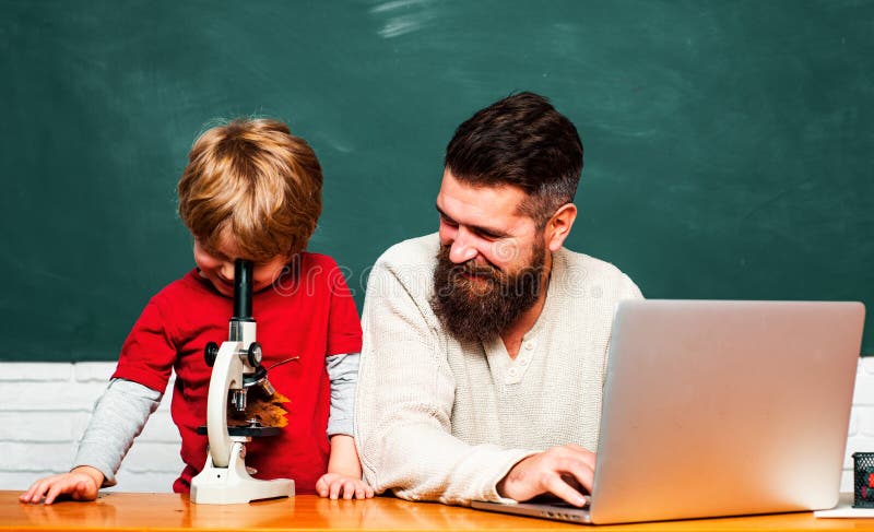 Elementary School Teacher and Student in Classroom. Daddy Play with ...