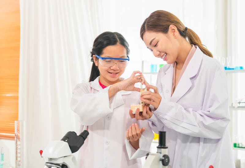 Elementary Science Class, Cheerful Kid Girl with Teacher Scientist in ...
