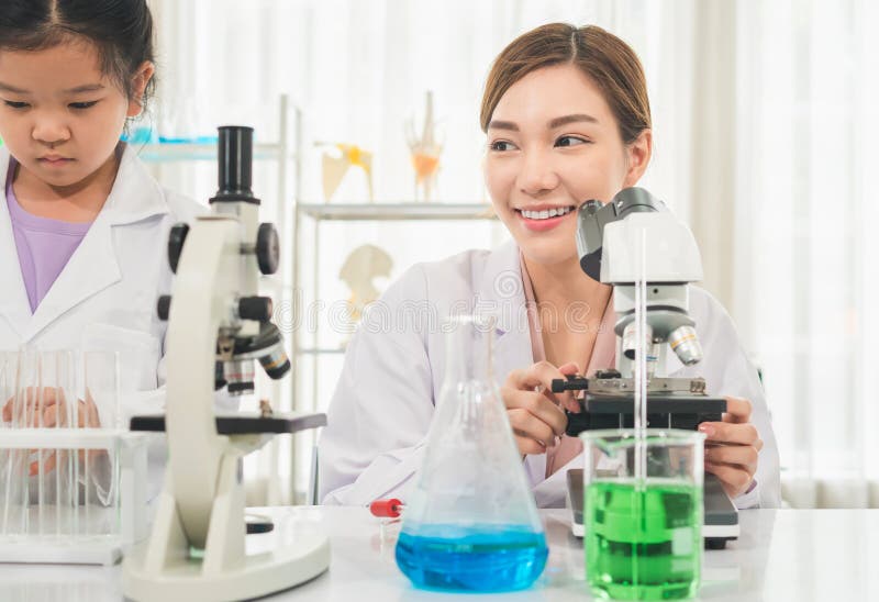 Elementary Science Class, Female Teacher Scientist with Kid Girl in ...