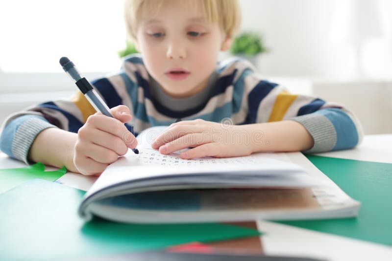 Elementary Student Boy Doing Homework at Home. Child Learning To Count ...