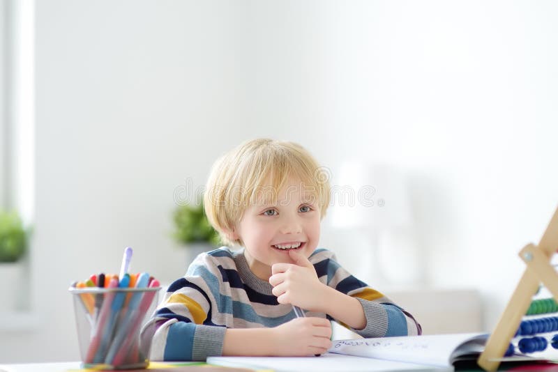 Elementary Student Boy Doing Homework at Home. Child Learning To Count ...