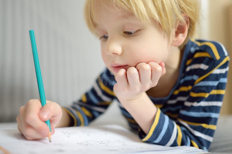 Elementary Student Boy Doing Homework at Home. Child Learning To Count ...