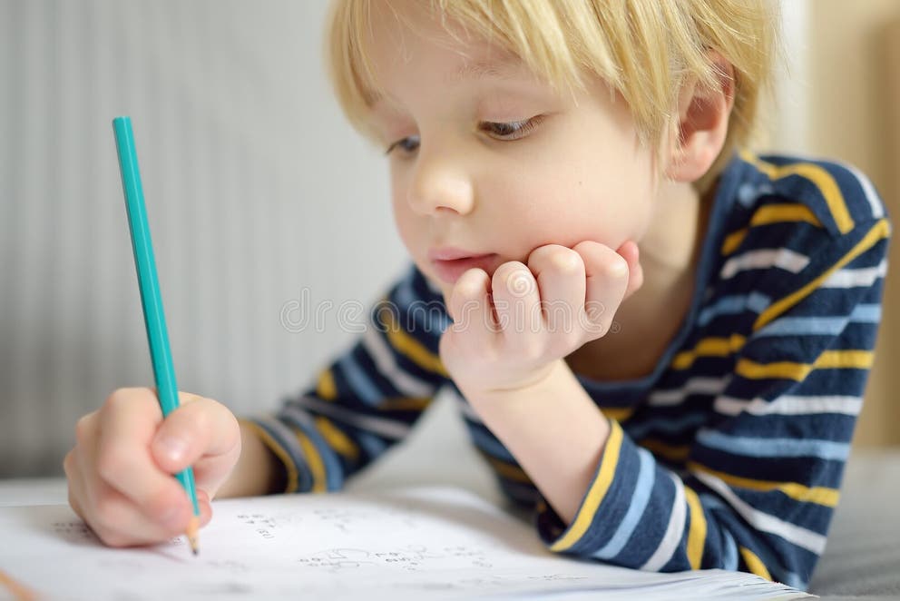 Elementary Student Boy Doing Homework at Home. Child Learning To Count ...