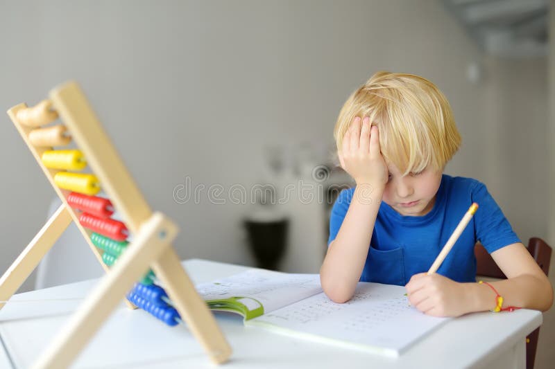 Elementary Student Boy Doing Homework at Home. Child Learning To Count ...