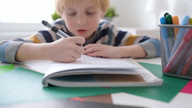 Elementary Student Boy Doing Homework at Home. Child Learning To Count ...