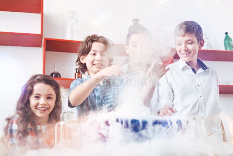 Elementary Students Conducting Experiment in Science Classroom Stock ...