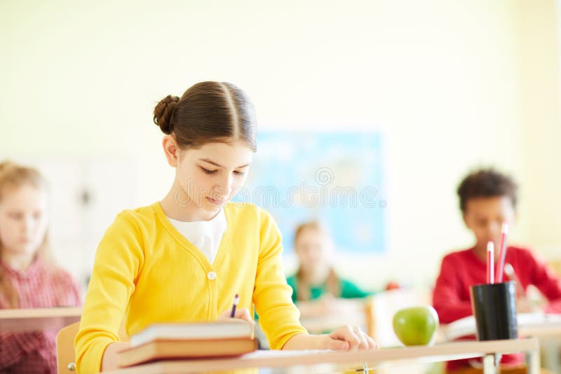 Thoughtful Elementary Student Passing Test Stock Photos - Free ...