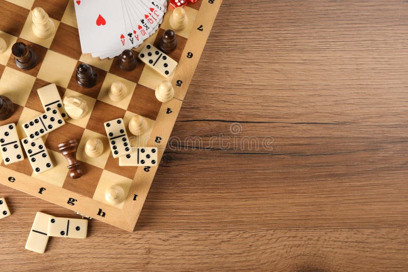 Elements of Different Board Games on Wooden Table, Flat Lay. Space for ...