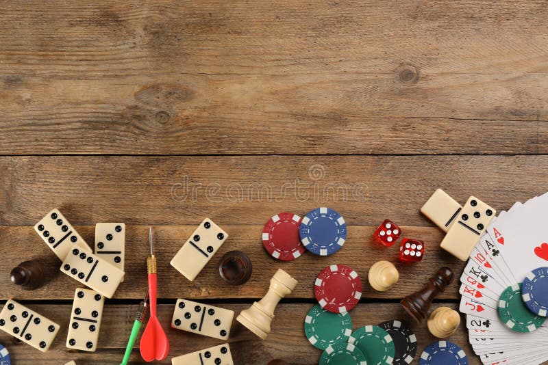 Elements of Different Board Games on Wooden Table, Flat Lay. Space for ...