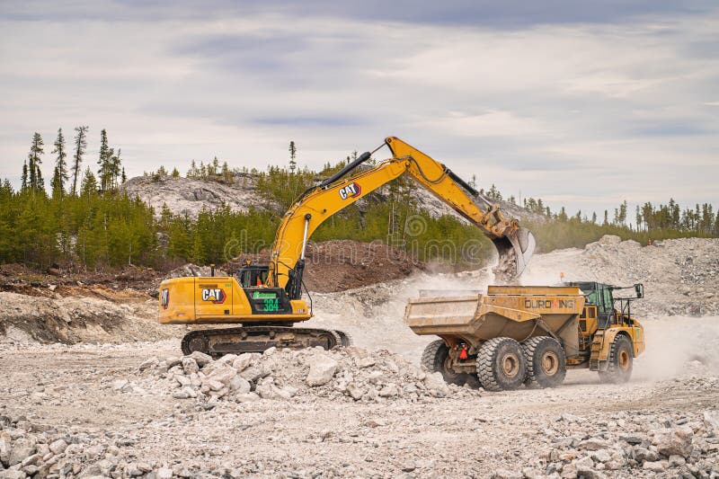 Dump Truck Transporting a Load of Stone on a Construction Site ...