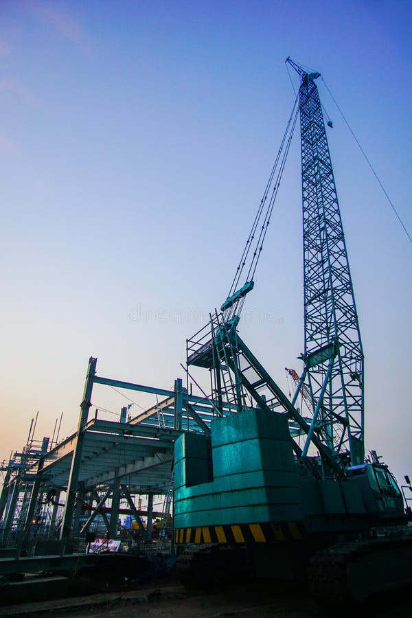 Elevated Crane Structure Amidst a Construction Project Exhibiting Steel ...