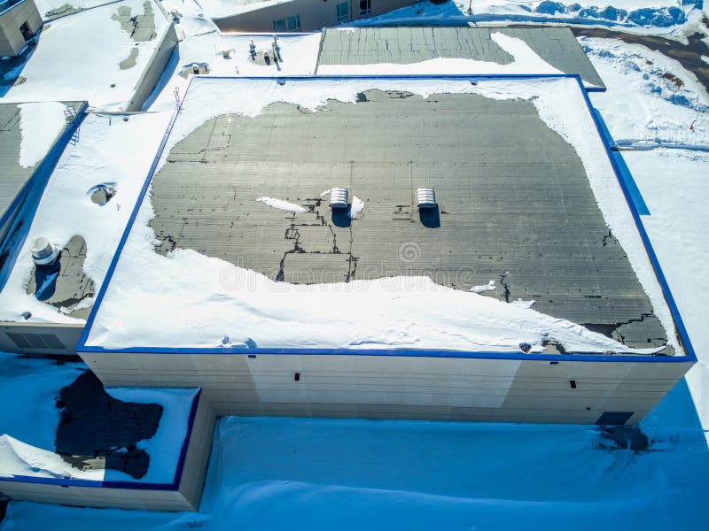 Elevated Overhead Drone View of a Flat Roofed Building with Snow Load ...