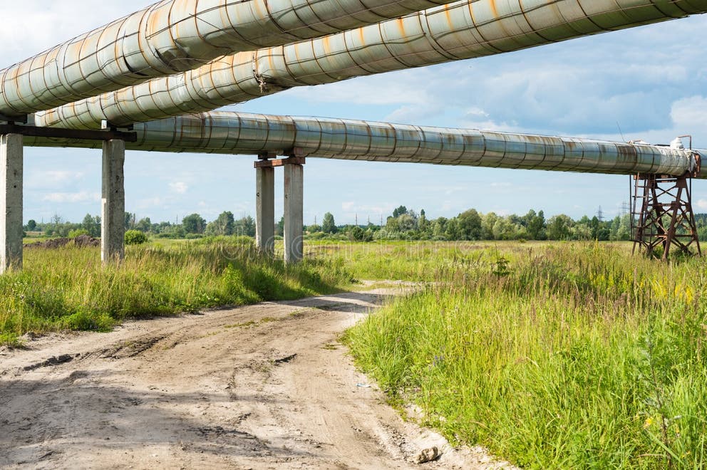 Elevated Section of the Pipelines Above the Dirt Road Stock Image ...