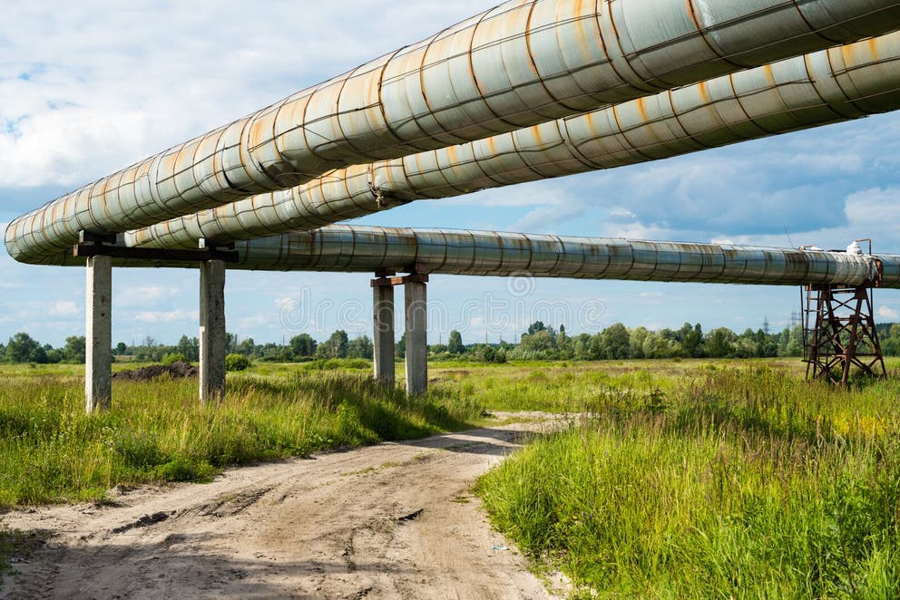 Elevated Section of the Pipelines Above the Dirt Road Stock Photo ...