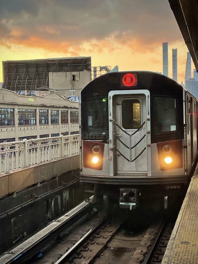 NYC Subway Train Pulls into Elevated Station at Sunset (Queens, New ...