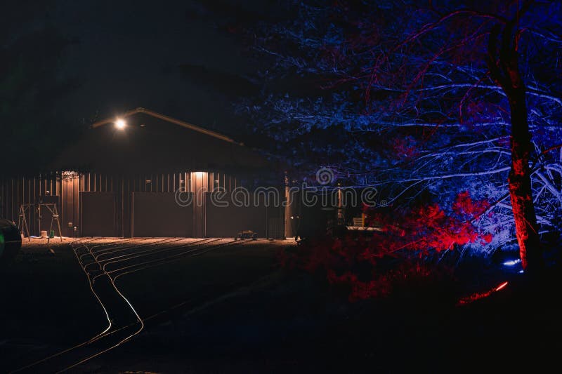 A Train Station at Night with the Light on and Its Tracks Illuminated ...