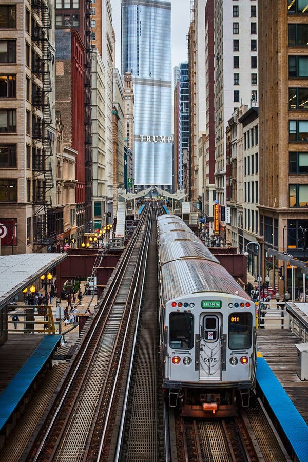 Elevated Train in Urban Chicago with Commuters and Architecture ...
