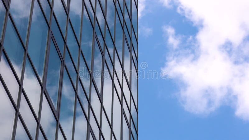 An Elevated View of a Building with a Glass Facade that is Split ...