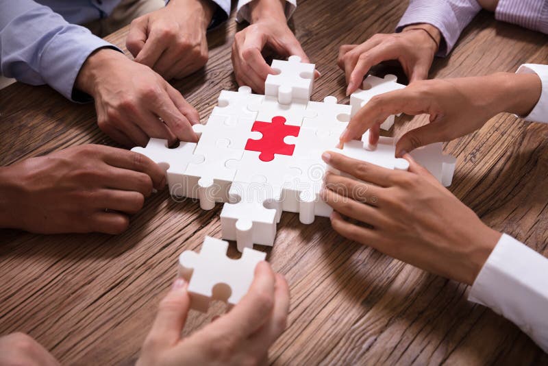 Elevated View of Businesspeople Solving Jigsaw Puzzle Stock Photo ...