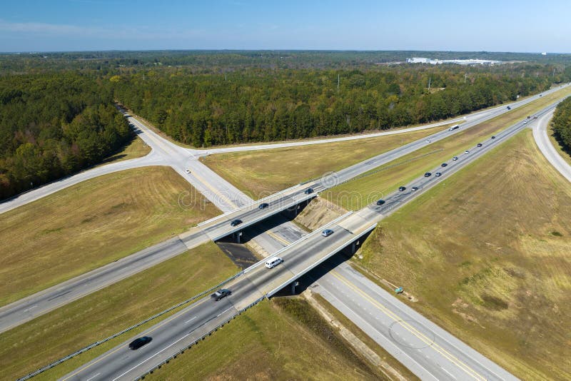 Elevated View of Freeway Exit Junction Over Road Lanes with Fast Moving ...