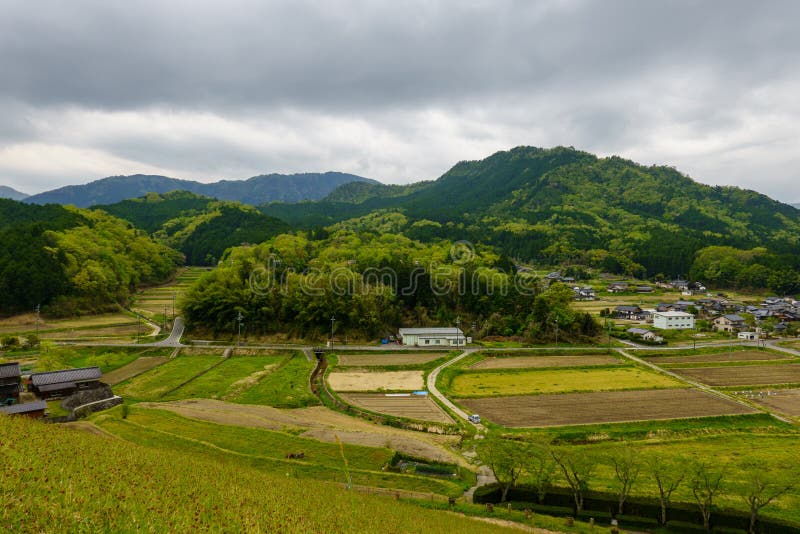 Elevated View of Grain Fields and Rural Homes Nestled in Mountains on ...