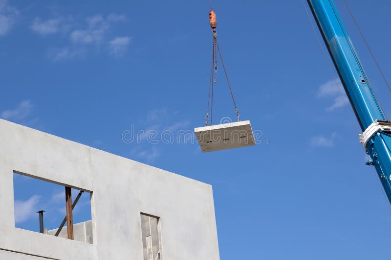 Elevating Crane Lifting a Concrete Plate Stock Photo - Image of ...