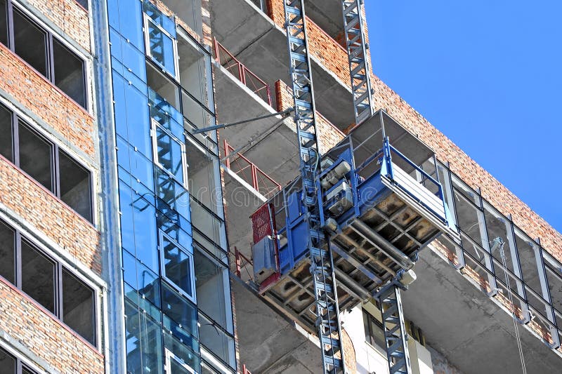 Elevator on Construction Site Stock Image - Image of lifting, house ...