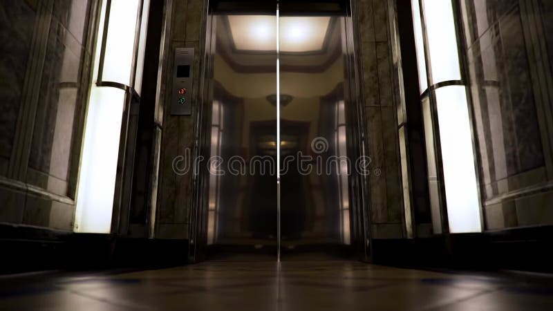 Elevator Doors Opening and Closing in a Dimly Lit Hallway Stock Video ...