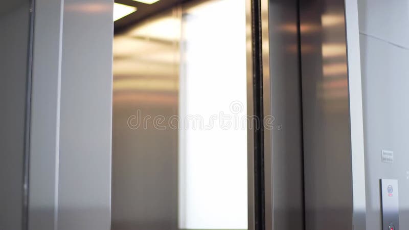 Elevator Doors Opening and Closing in a Modern Building Stock Video ...