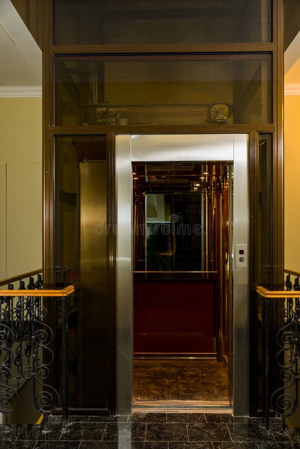 Lift with open metal doors stock photo. Image of lobby - 114284042