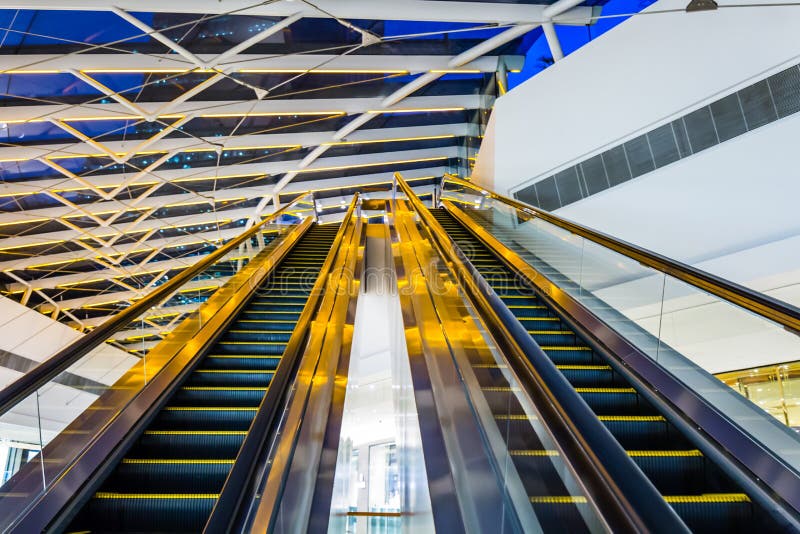 Escalator in shopping mall stock photo. Image of customer - 59564902