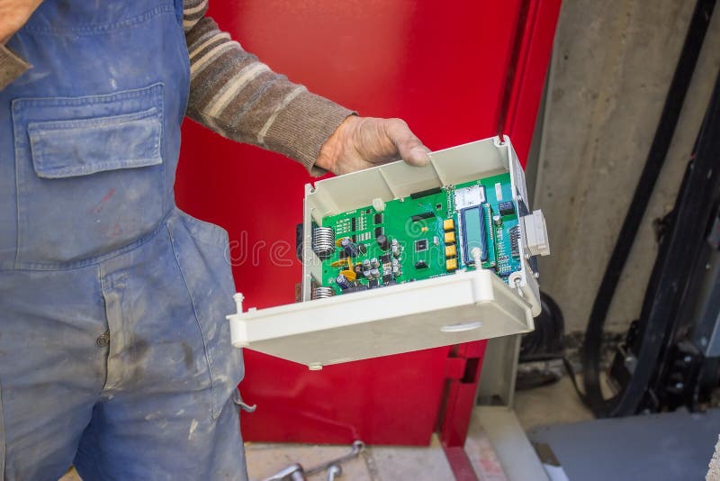 Elevator Technician Prepare the Elevator Control Panel for Installation ...