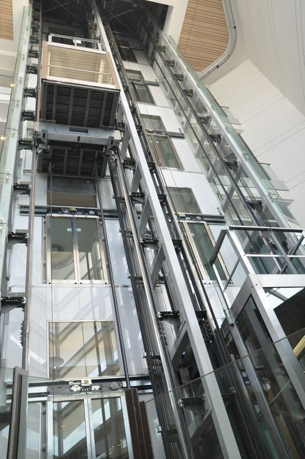 Two Elevators Inside White Building Stock Image - Image of wall, design ...