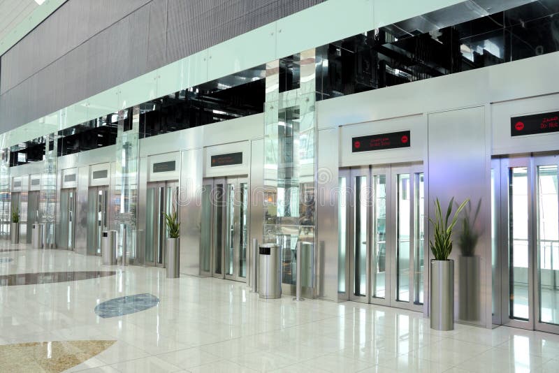 Elevators Moving at the Same Time in Dubai Airport Stock Image - Image ...