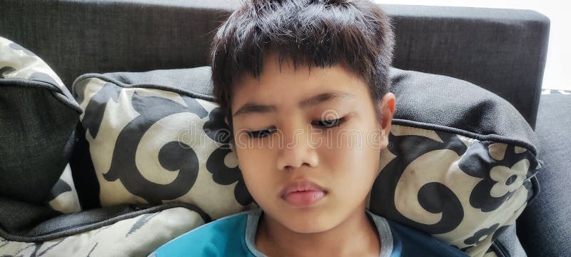 Boy with sad expression stock image. Image of hair, years - 239251247