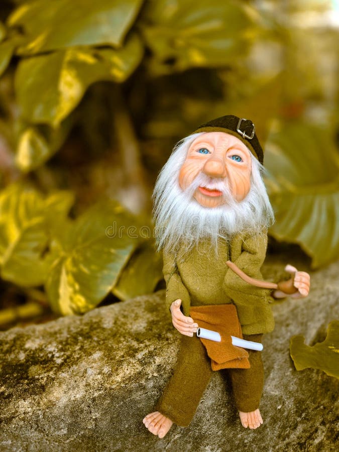 Elf Nature Element Sitting in Flowerbed with Mango Tree and Giboia ...