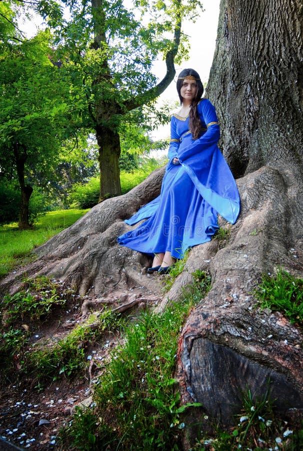 Elf Princess in Roots of Big Tree Stock Photo - Image of crown ...