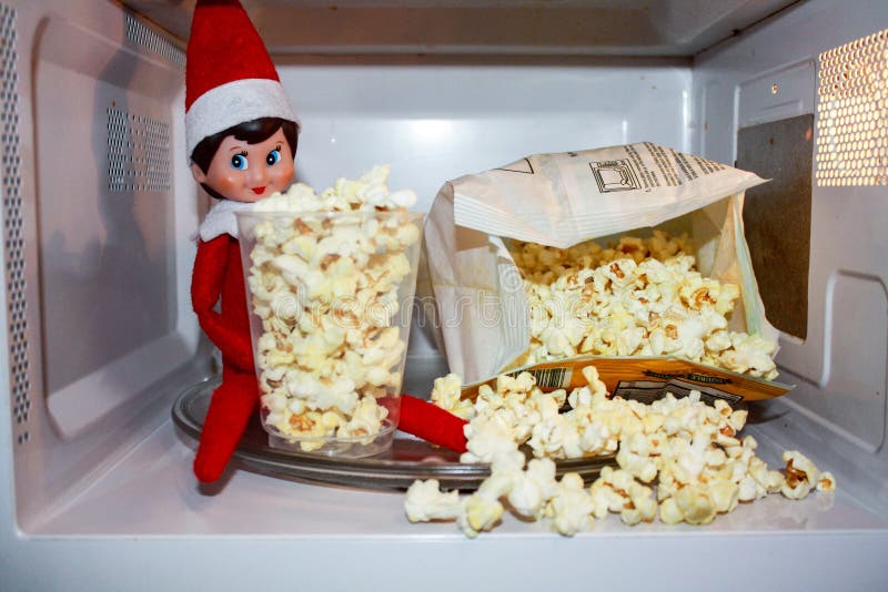 Christmas Elf Sitting on a Snowy Shelf with Peppermint Sticks and ...