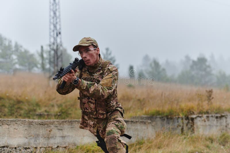 An Elite Soldier, Camouflaged and Stealthily Navigating through ... An Elite Soldier, Camouflaged and Stealthily Navigating through ...