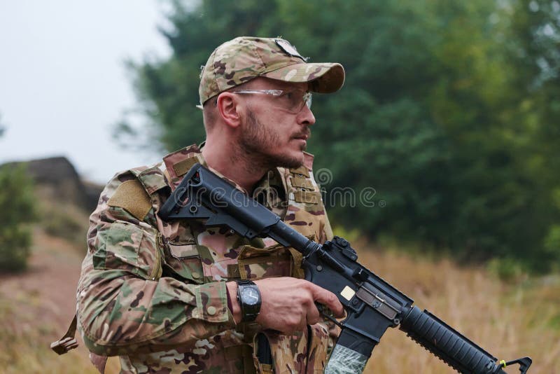 An Elite Soldier, Camouflaged and Stealthily Navigating through ... An Elite Soldier, Camouflaged and Stealthily Navigating through ...