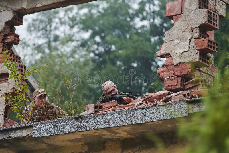An Elite Soldier, Camouflaged and Stealthily Navigating through ... An Elite Soldier, Camouflaged and Stealthily Navigating through ...